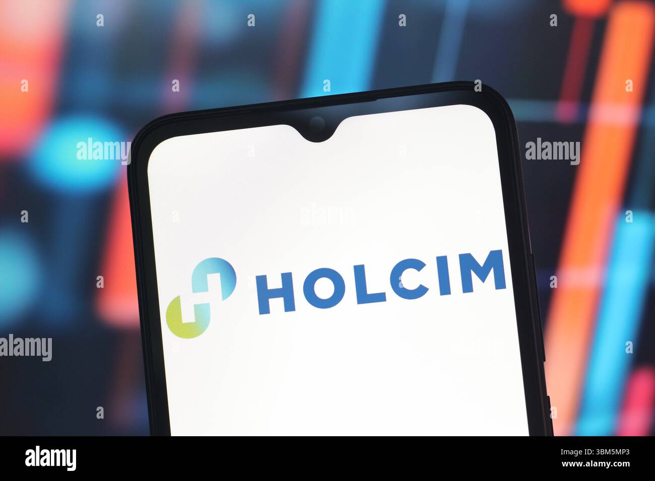 In this photo illustration, the Holcim logo is seen displayed on a ...