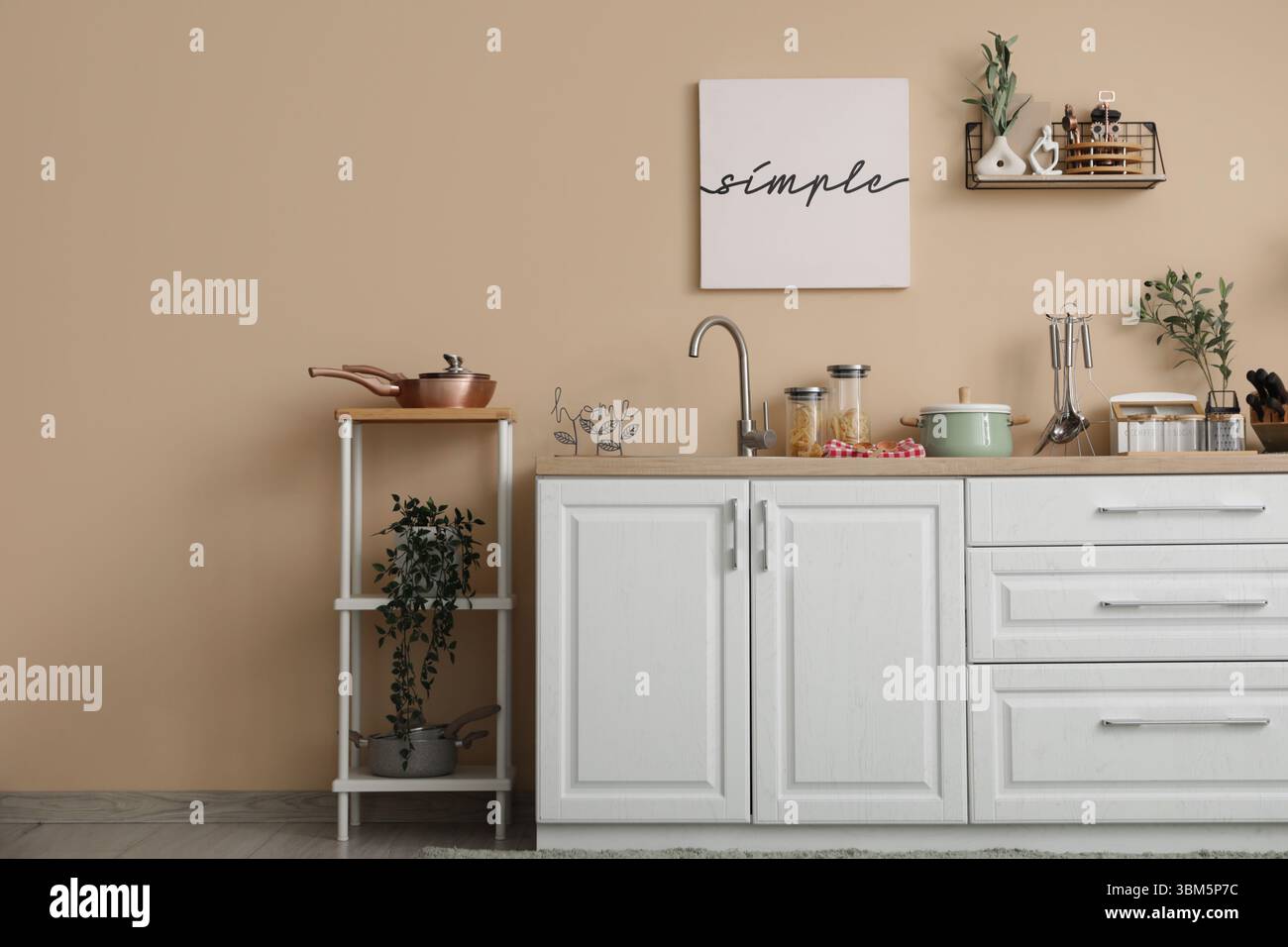 Interior of kitchen with counters, shelf unit and utensils Stock Photo ...