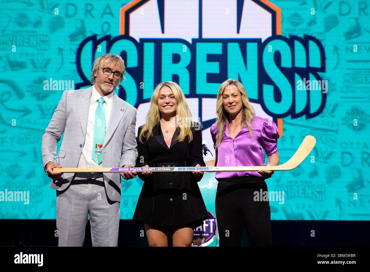 Casey O'Brien, center, poses for a photo after the New York Sirens ...