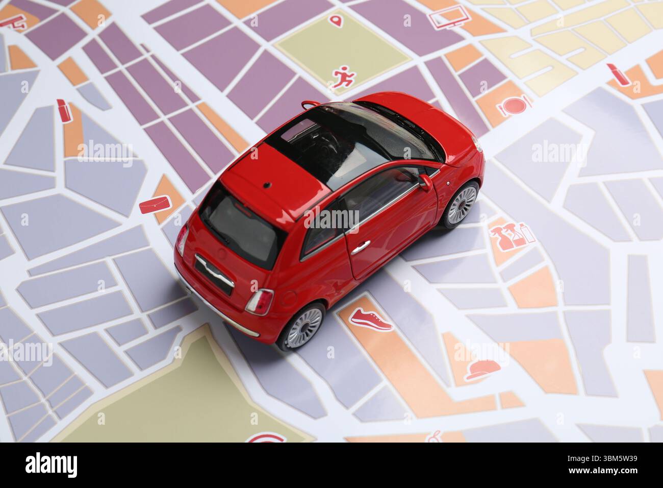 Road trip concept. Car model on city map Stock Photo - Alamy