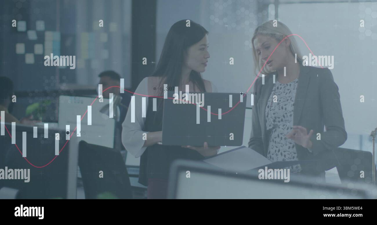 Reviewing chart overlay on laptop in office by business analyst and project manager, with ...