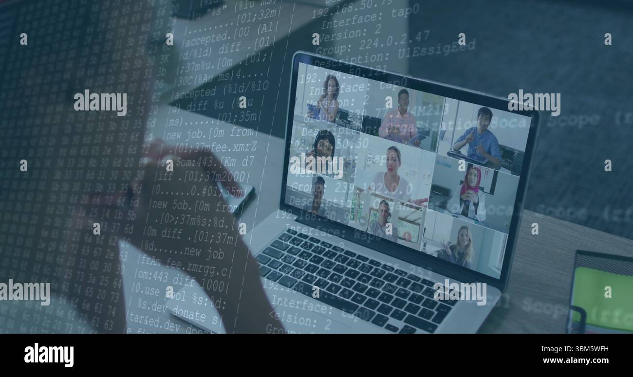Showing laptop displaying nine-person team meeting in office with ...