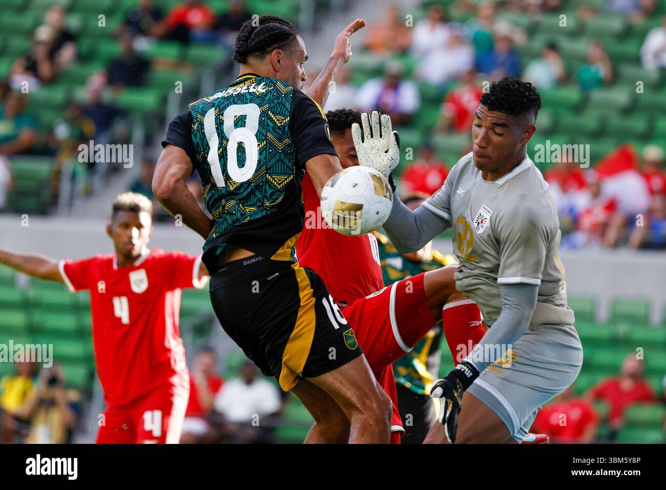 AUSTIN, TX - JUNE 24: Jamaica midfielder Jon Russell (18) attempts a ...