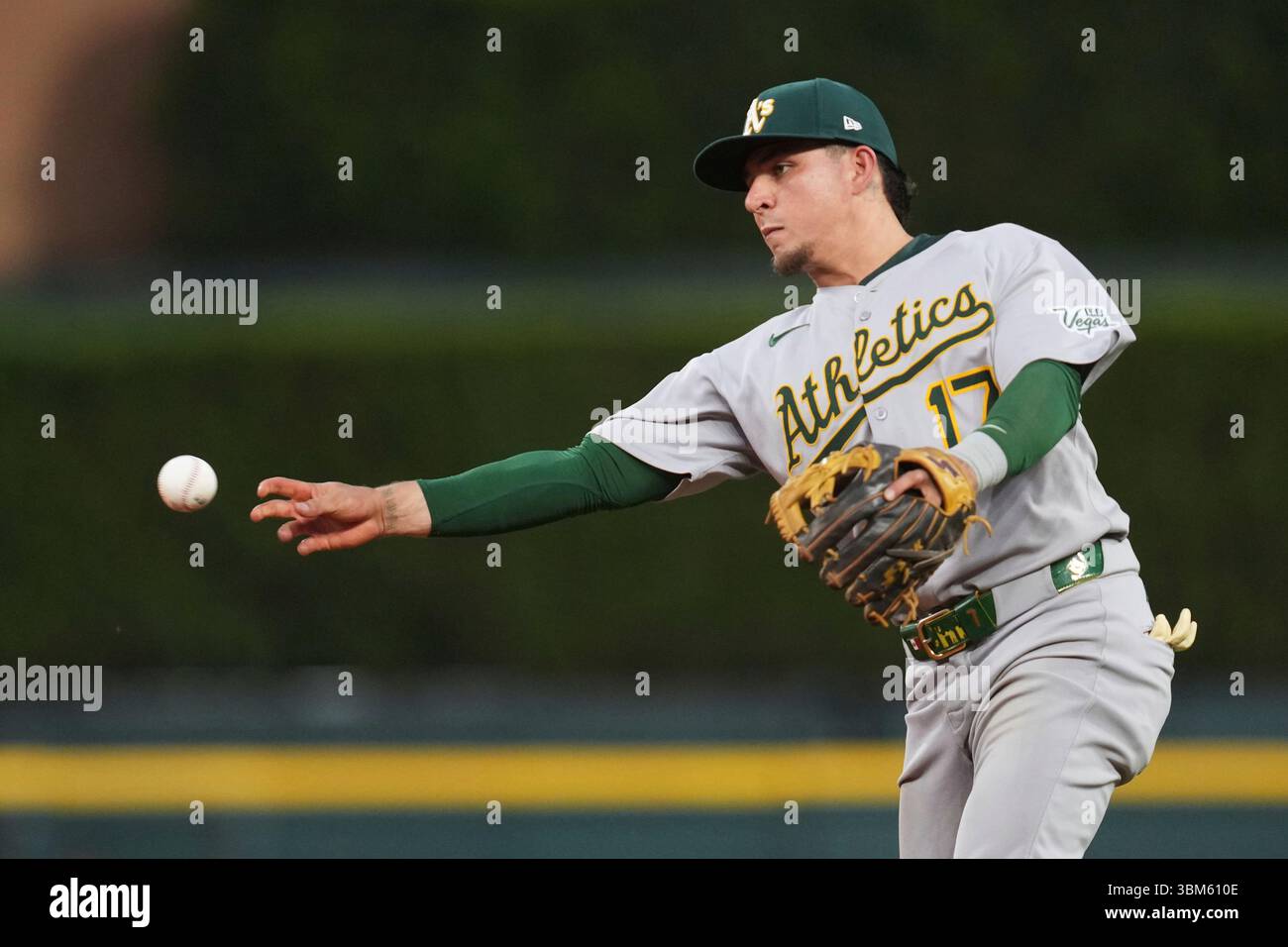 Athletics second baseman Luis Urías throws to first base for an out on ...