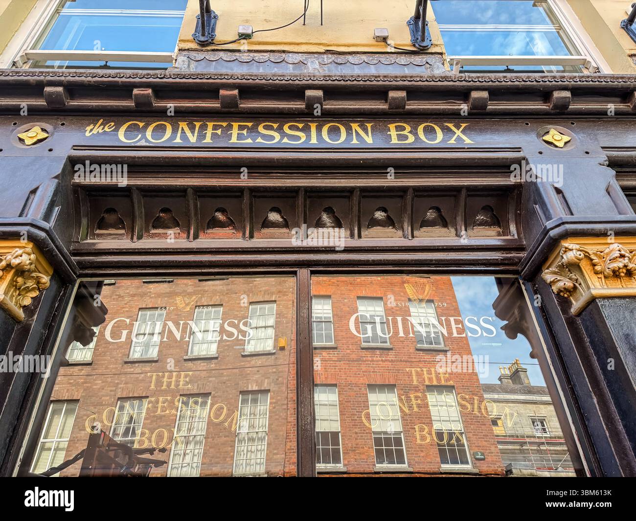 The Confession Box pub sign in Dublin, Ireland. Reflection in the ...