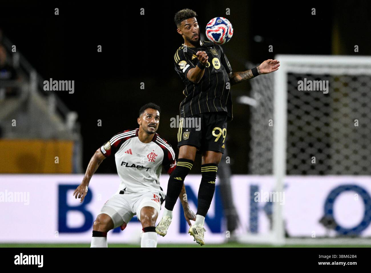 Los Angeles FC's Denis Bouanga, top, controls a ball chased by Flamengo ...