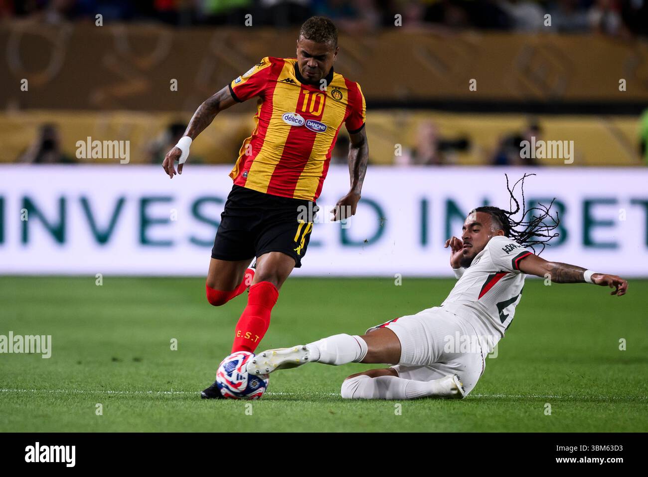 Yan Sasse of Esperance Sportive de Tunis is tackled by Malo Gusto of ...