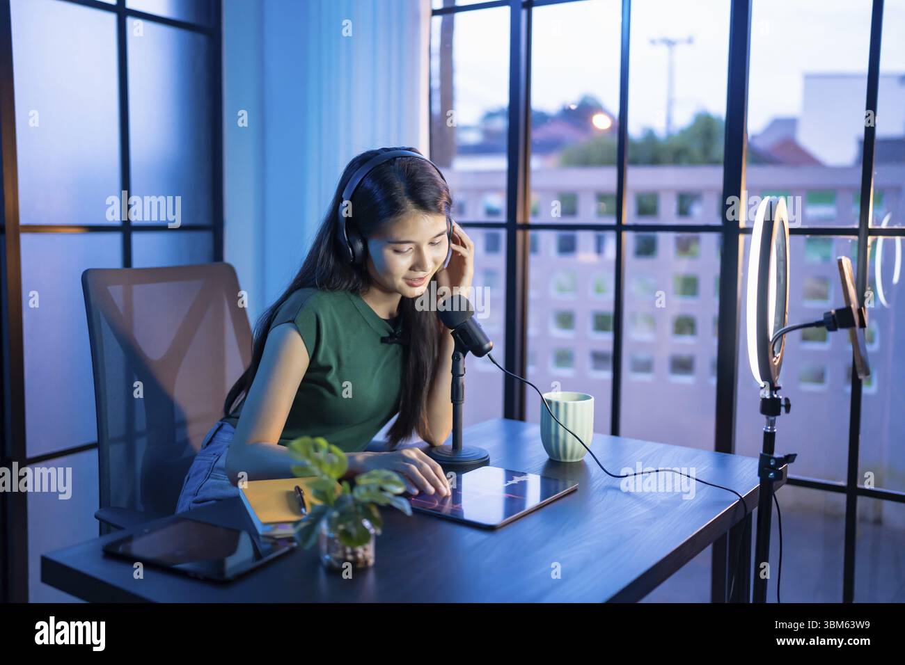 Content creator Young asian woman influencer creating content in home ...