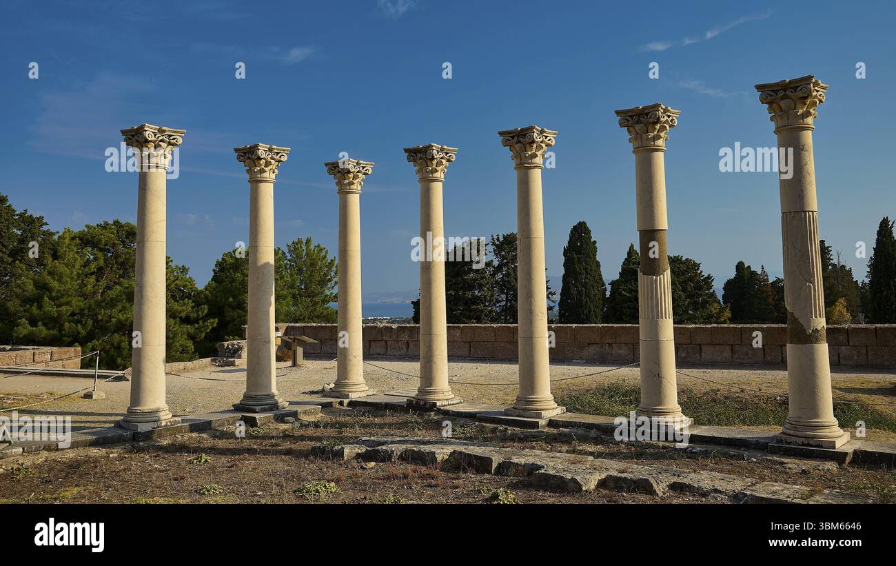 Six ancient columns with capitals in front of a clear sky, part of a ...