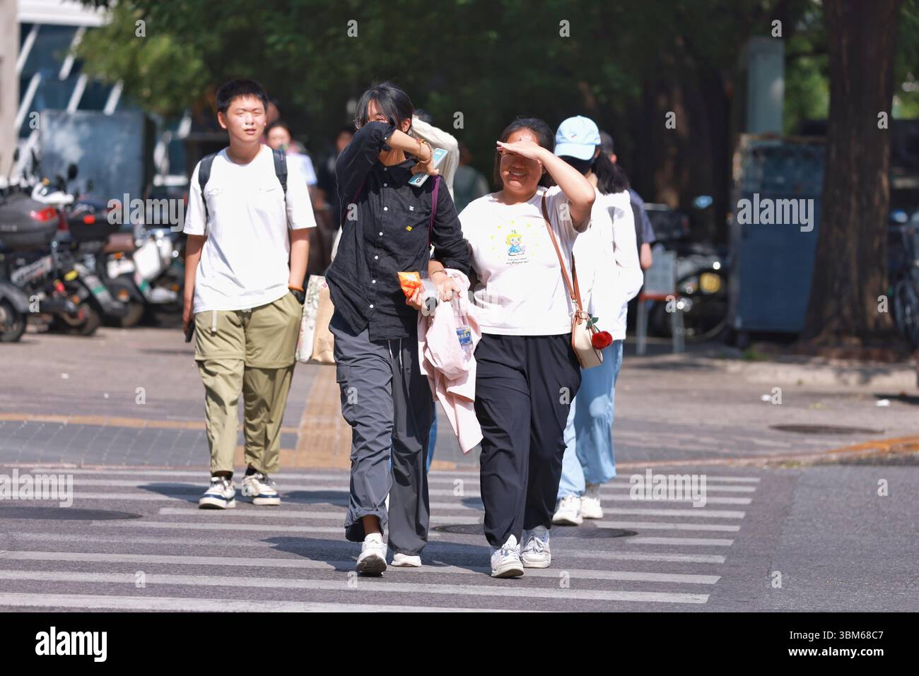 **CHINESE MAINLAND, HONG KONG, MACAU AND TAIWAN OUT** People shielding ...