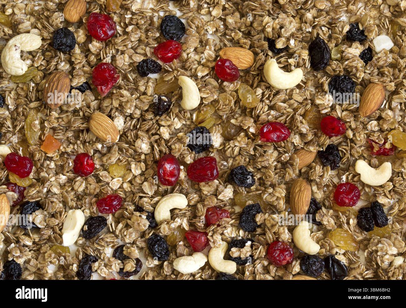 Texture Granola with dried cherries and nuts. Food background and ...