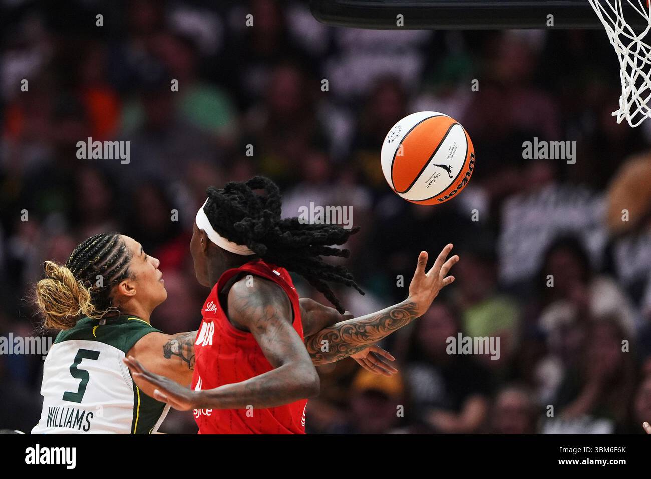 Seattle Storm forward Gabby Williams, left, is fouled by Indiana Fever ...