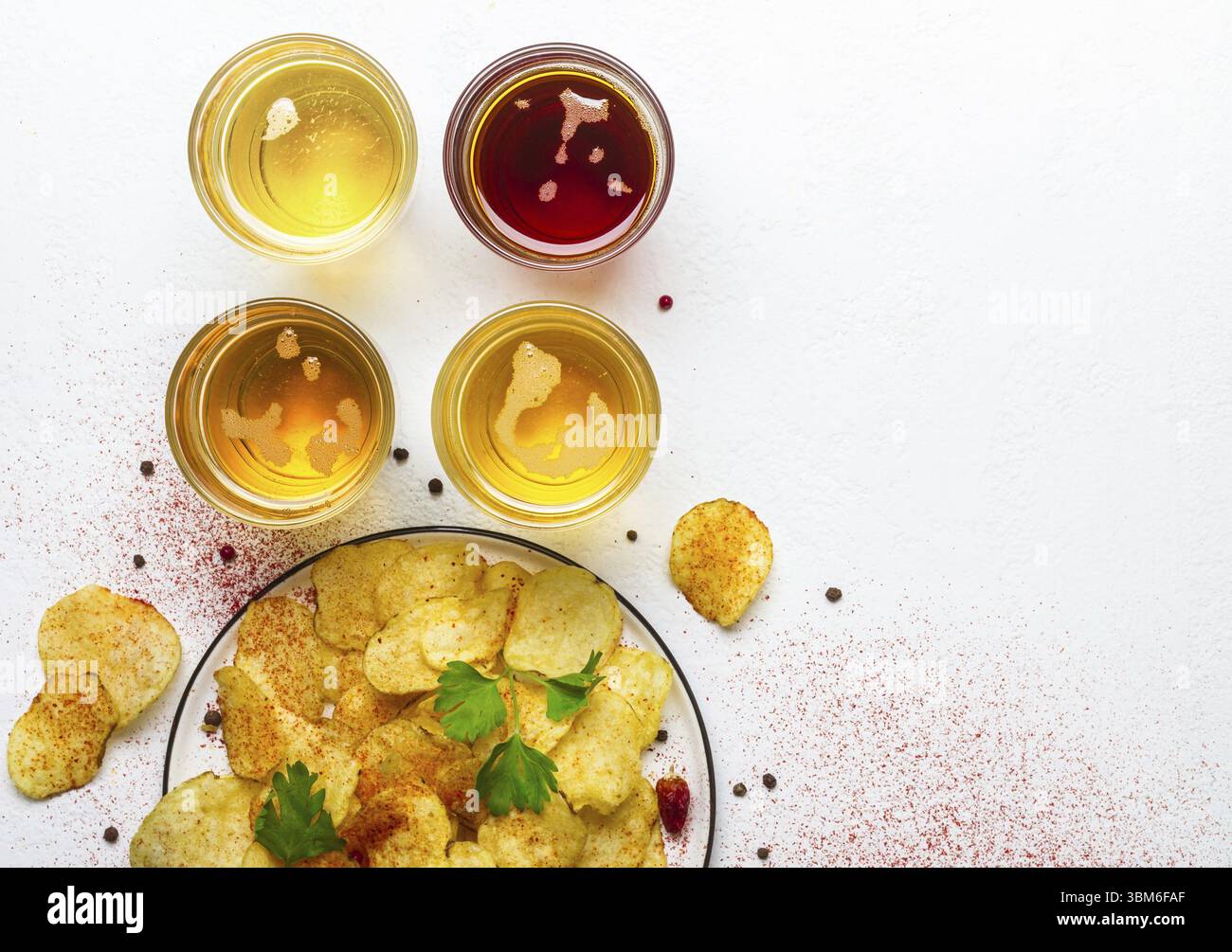 Assorted light and dark Beers and chips Stock Photo - Alamy