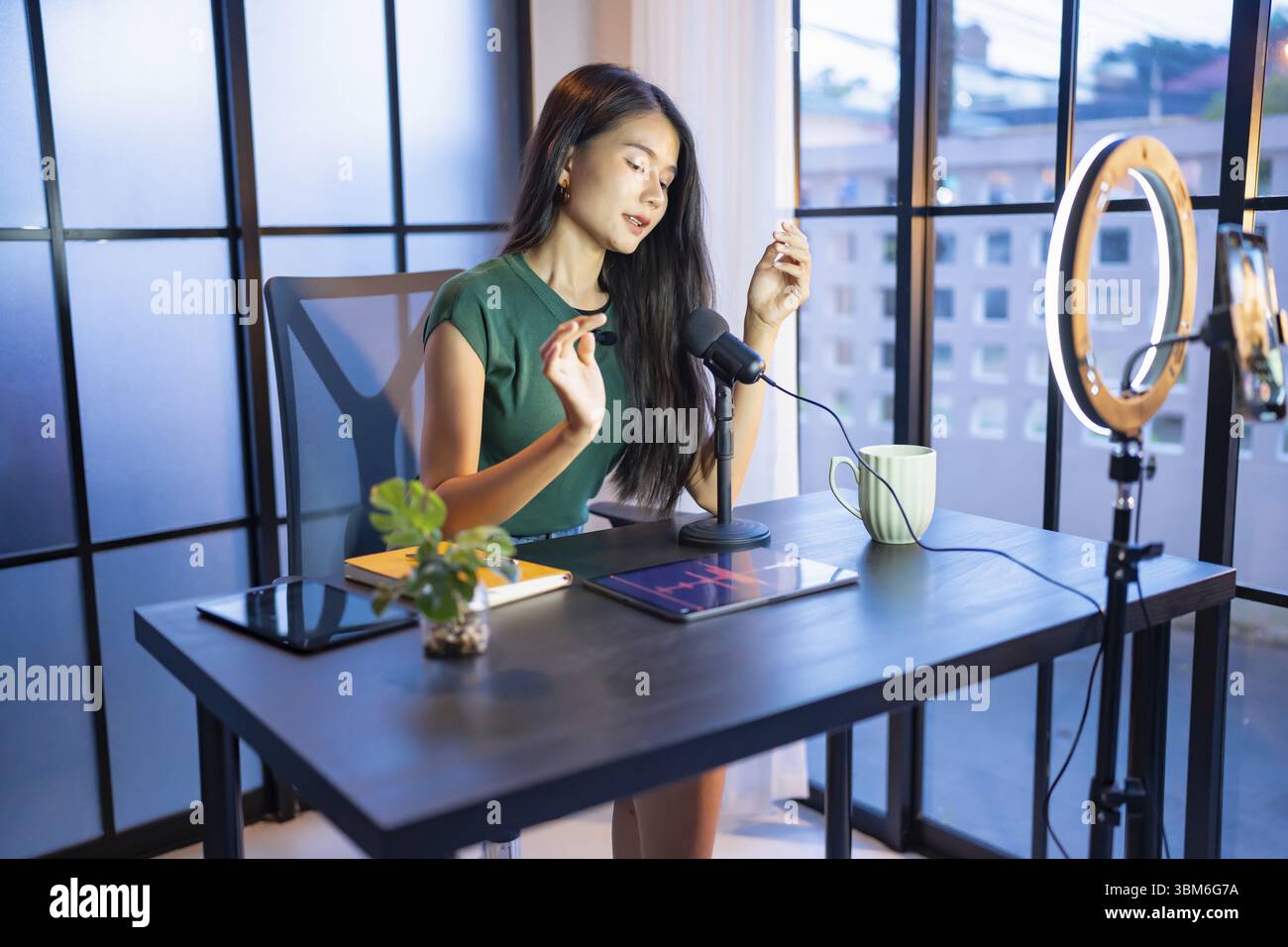 Content creator Young asian woman influencer creating content in home ...