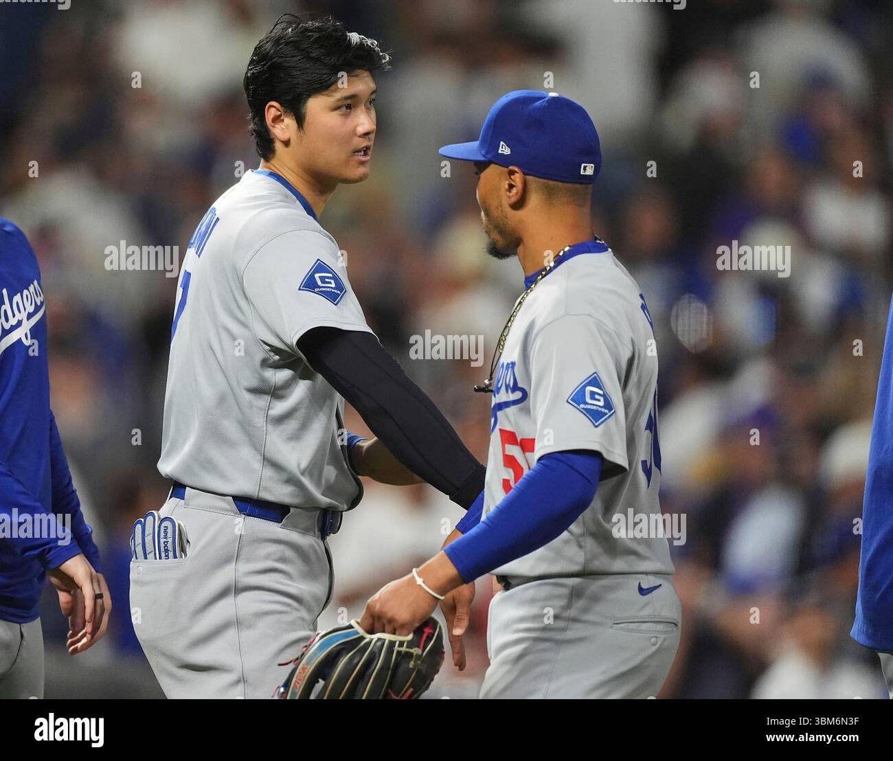 Los Angeles Dodgers designated hitter Shohei Ohtani, left ...
