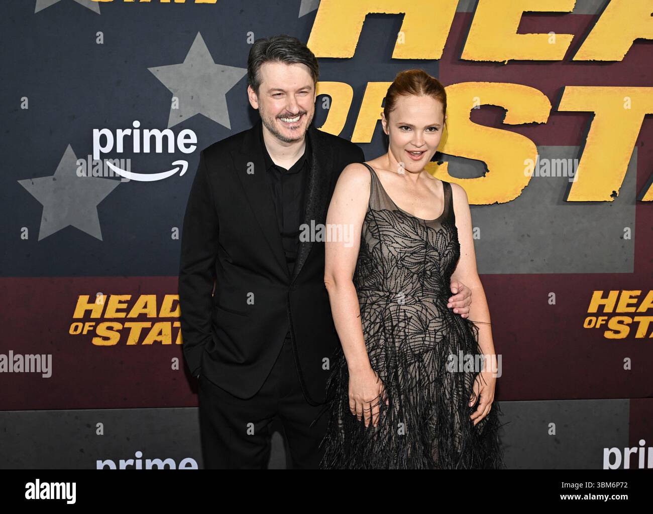 Director Ilya Naishuller, left, and wife Darya Charusha attend the ...