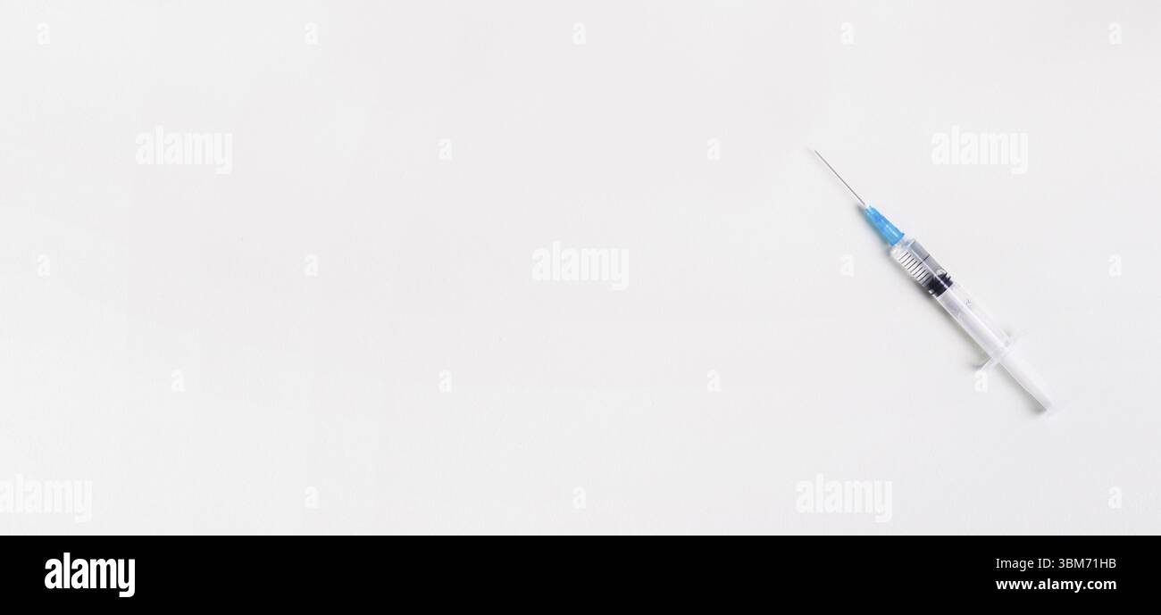 Vaccination concept. Syringe with vaccine on gray background. Banner ...