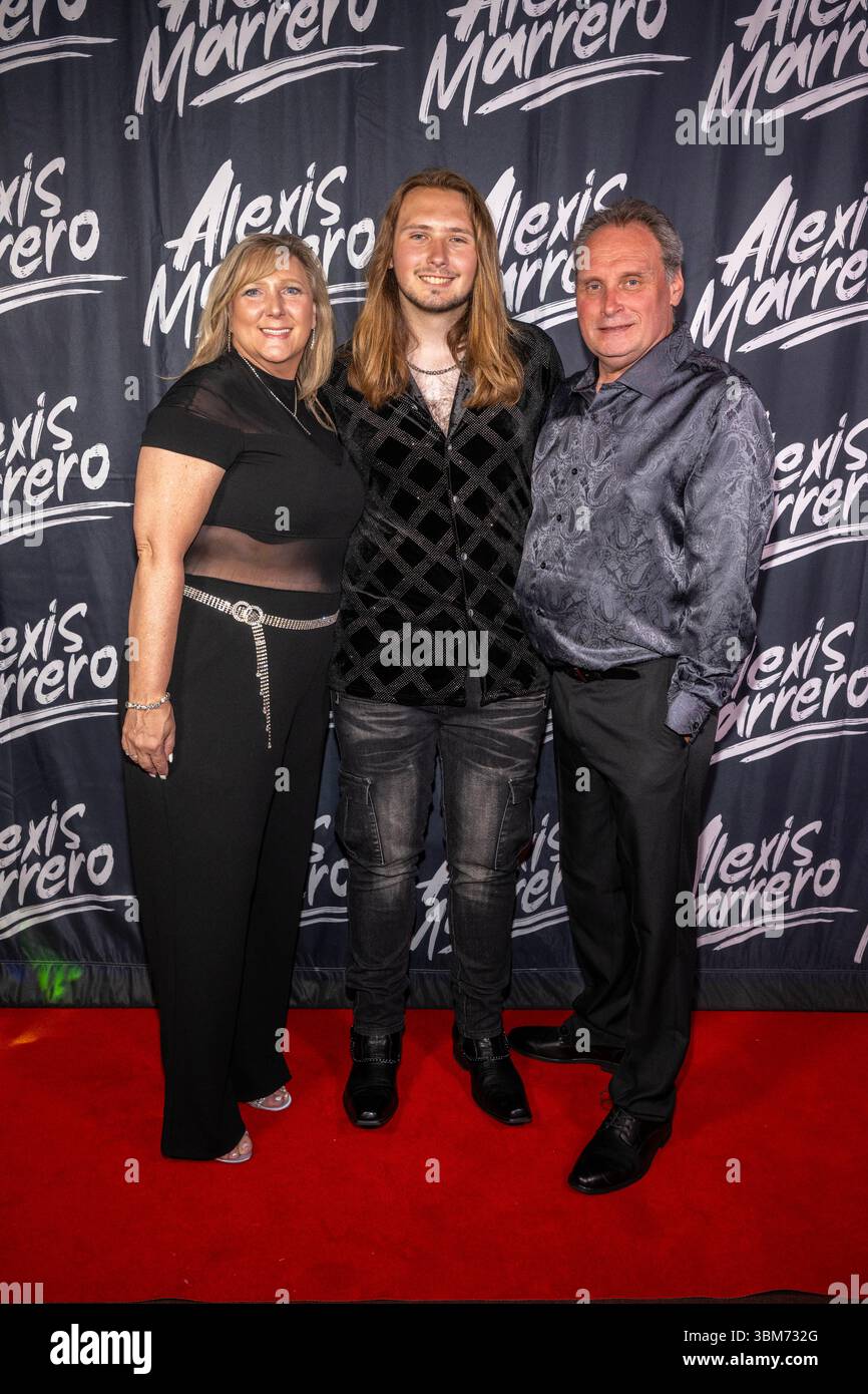 Band Bassist Ryan Saghy with parents Kim and Jeff attends Alexis ...