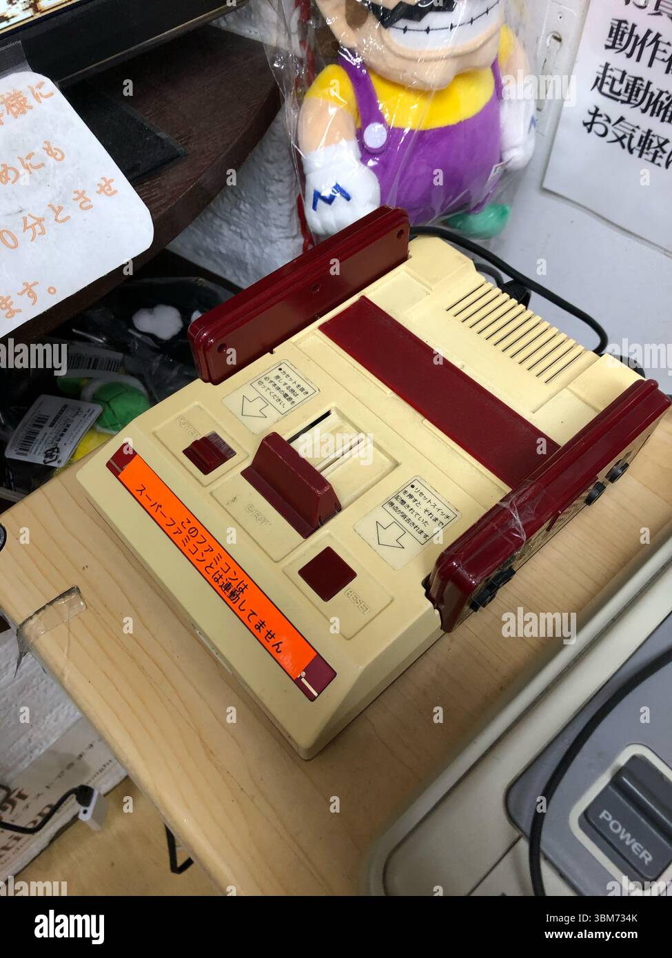 Tokyo, Japan 12.30.2019 A rare beige Dendy gaming console on a counter ...