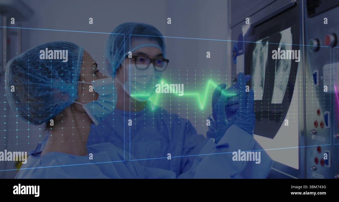 Examining two medics in blue scrubs studying Xray scans in imaging ...