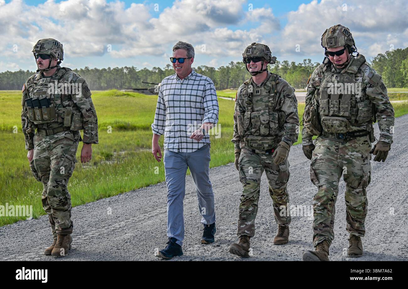 Secretary of the Army, Hon. Dan Driscoll, walks on the range with ...
