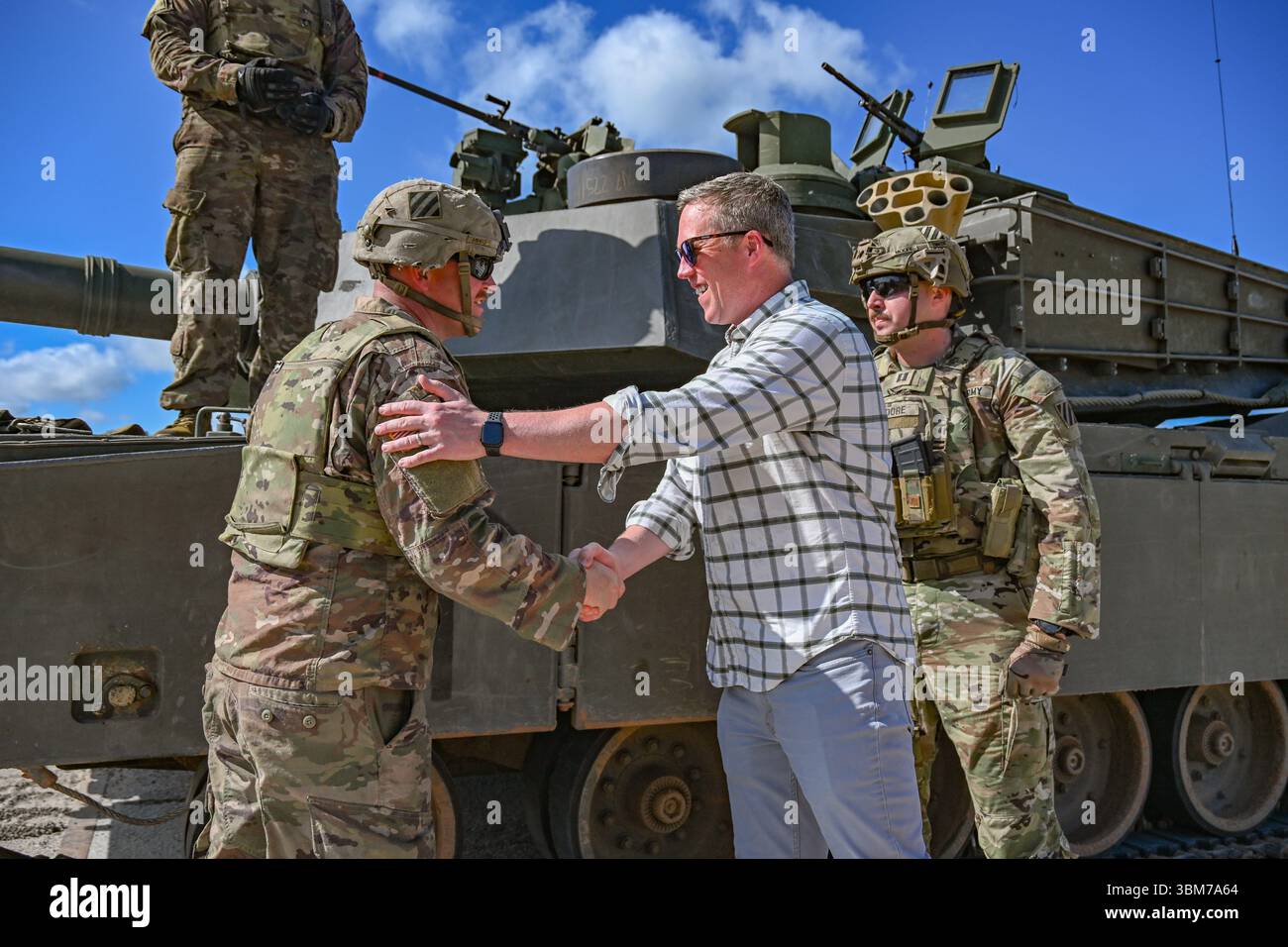 Secretary of the Army, Hon. Dan Driscoll, greets the crew of an M1A2 ...