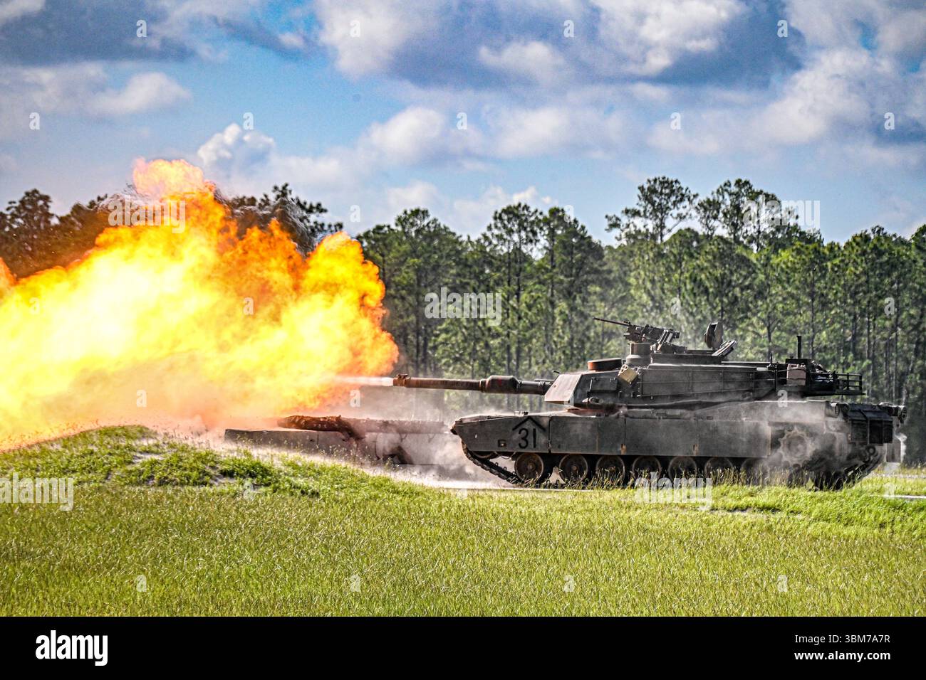 An M1A2 Abrams Tank fires a round at Fort Stewart, GA., June 23, 2025 ...
