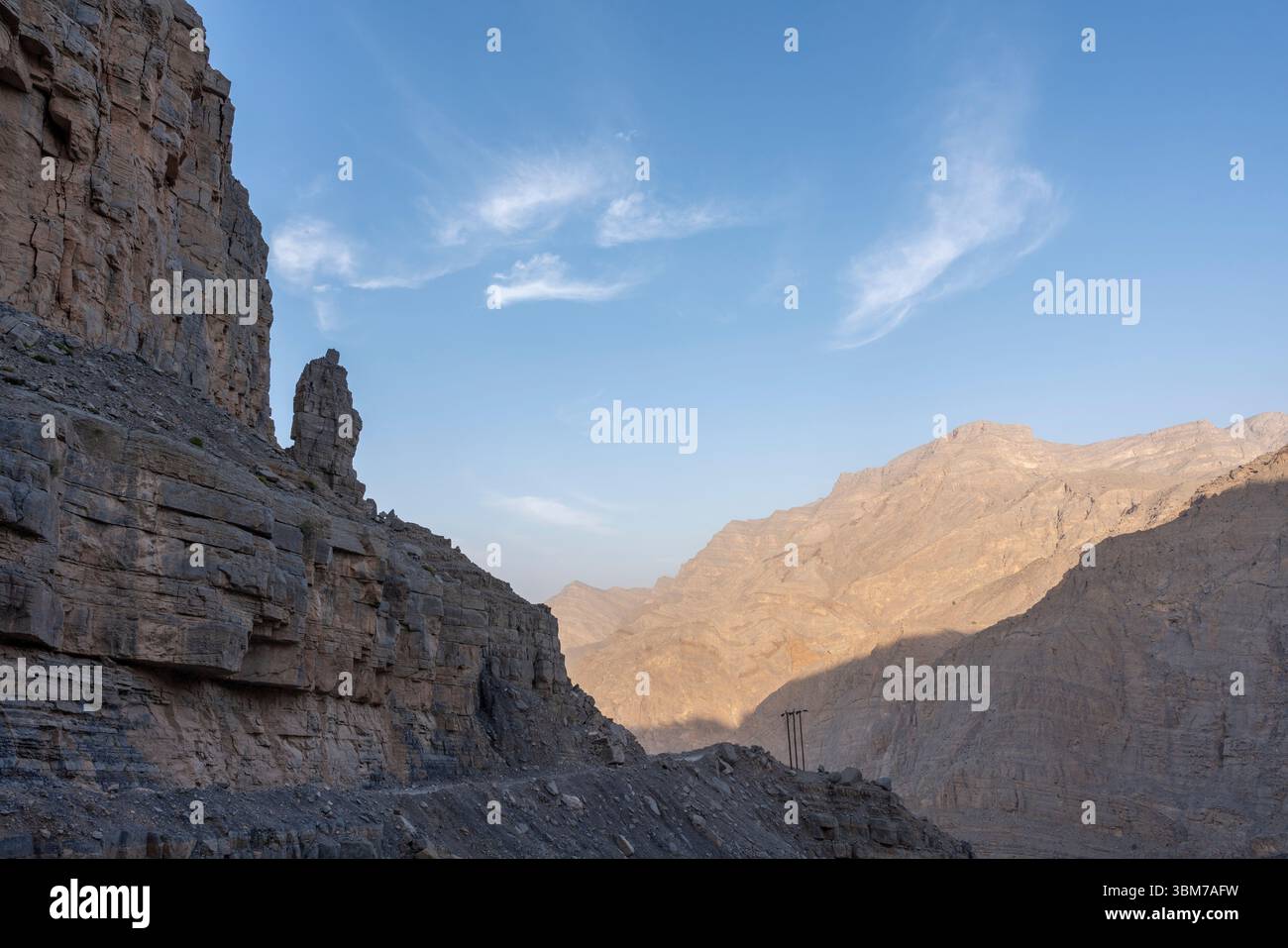 Towering limestone rock pillars and cliff formations against blue sky ...