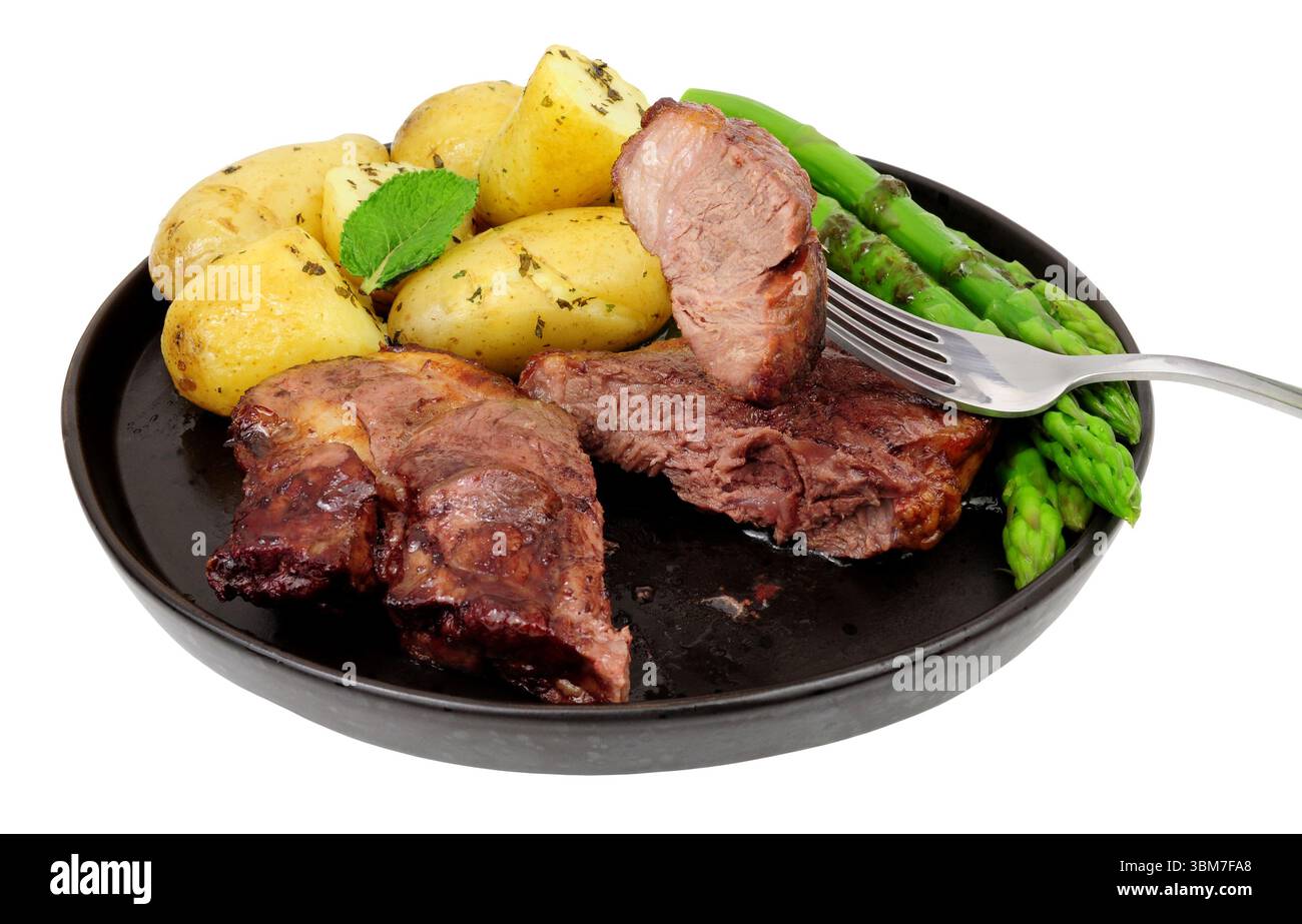 Grilled lamb rump steak meal with boiled new potatoes, asparagus and ...