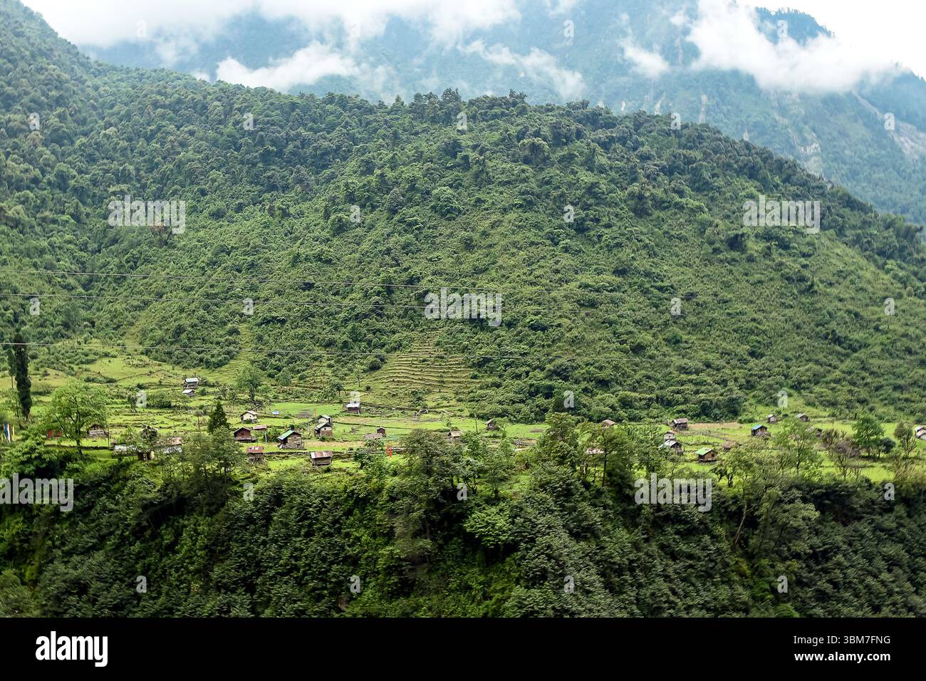 A picturesque mountain view of a small village nestled in the hills of ...
