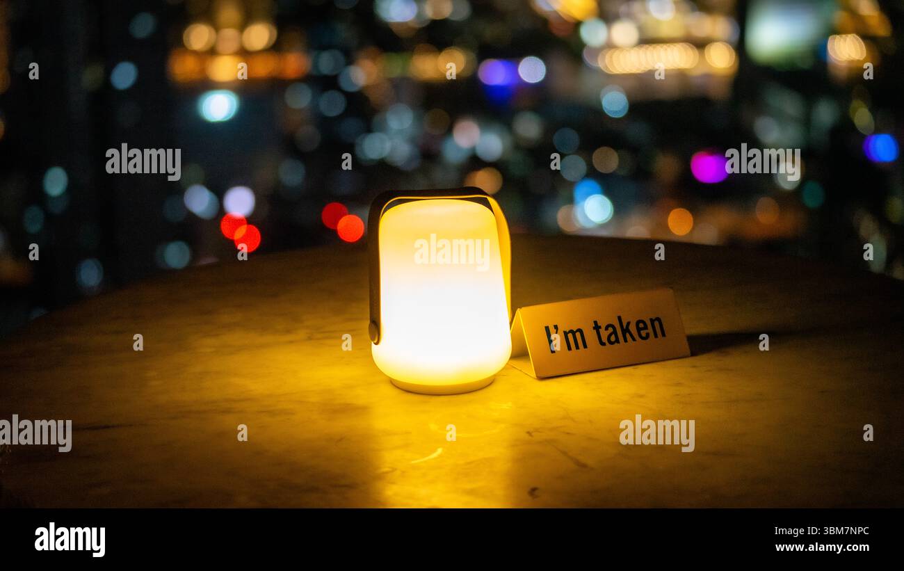 Table reservation at night Stock Photo - Alamy