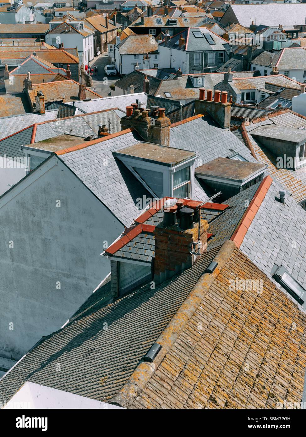 The summer seaside seafront rooftops of St Ives town in Cornwall ...