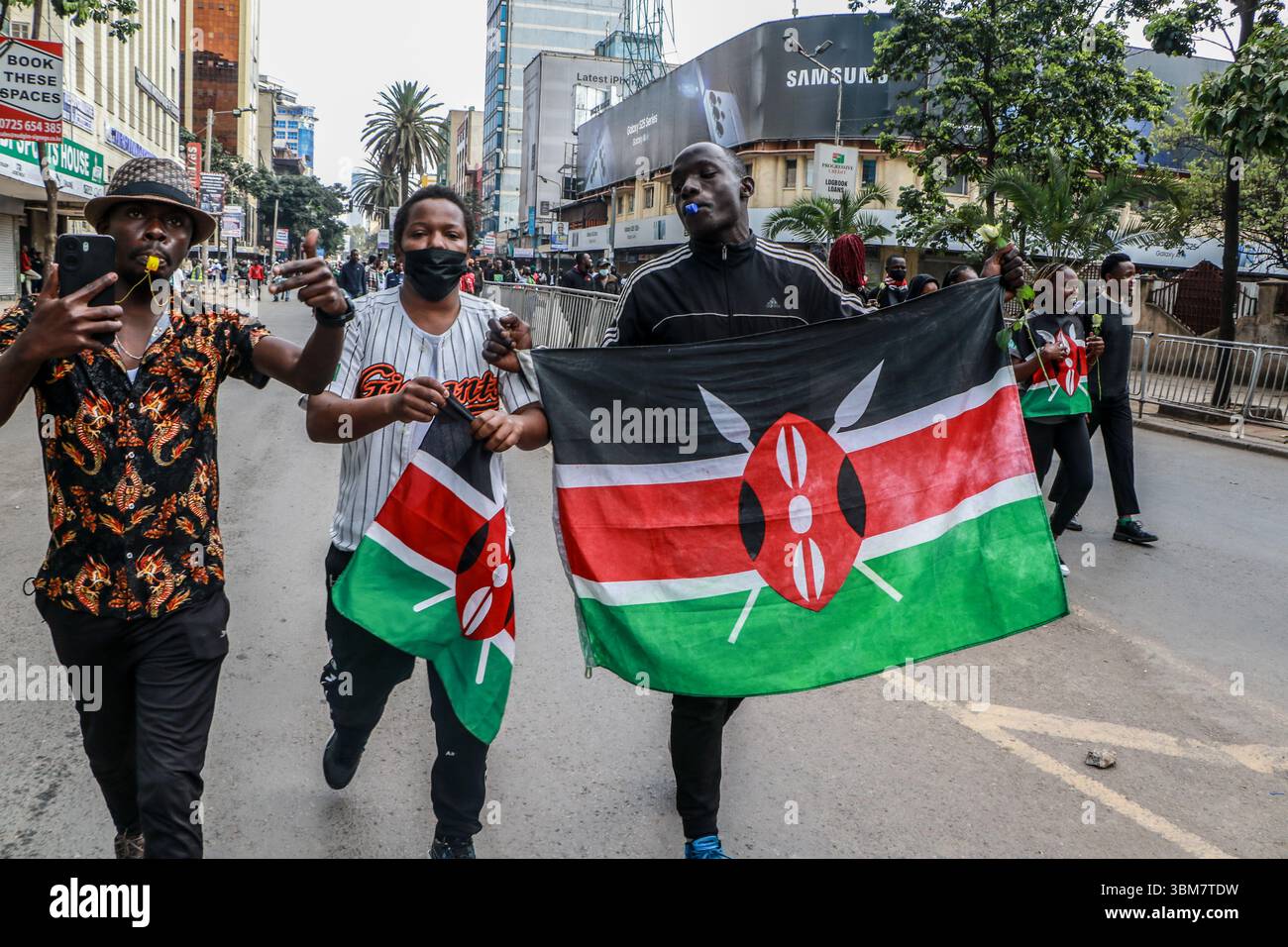 Nairobi, Kenya. 25th June, 2025. Protesters wave the Kenyan flags while ...