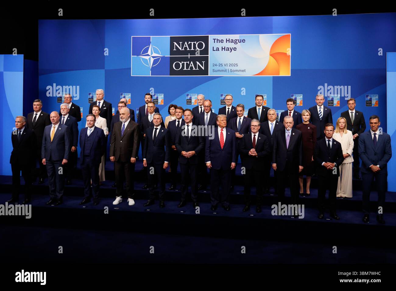 NATO heads of state and government pose for a group photo during the ...