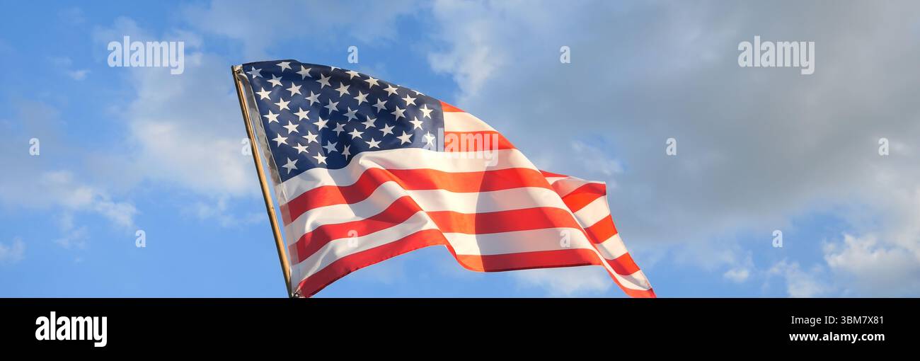 America flag wave under blue sky in celebration of the nation holiday ...