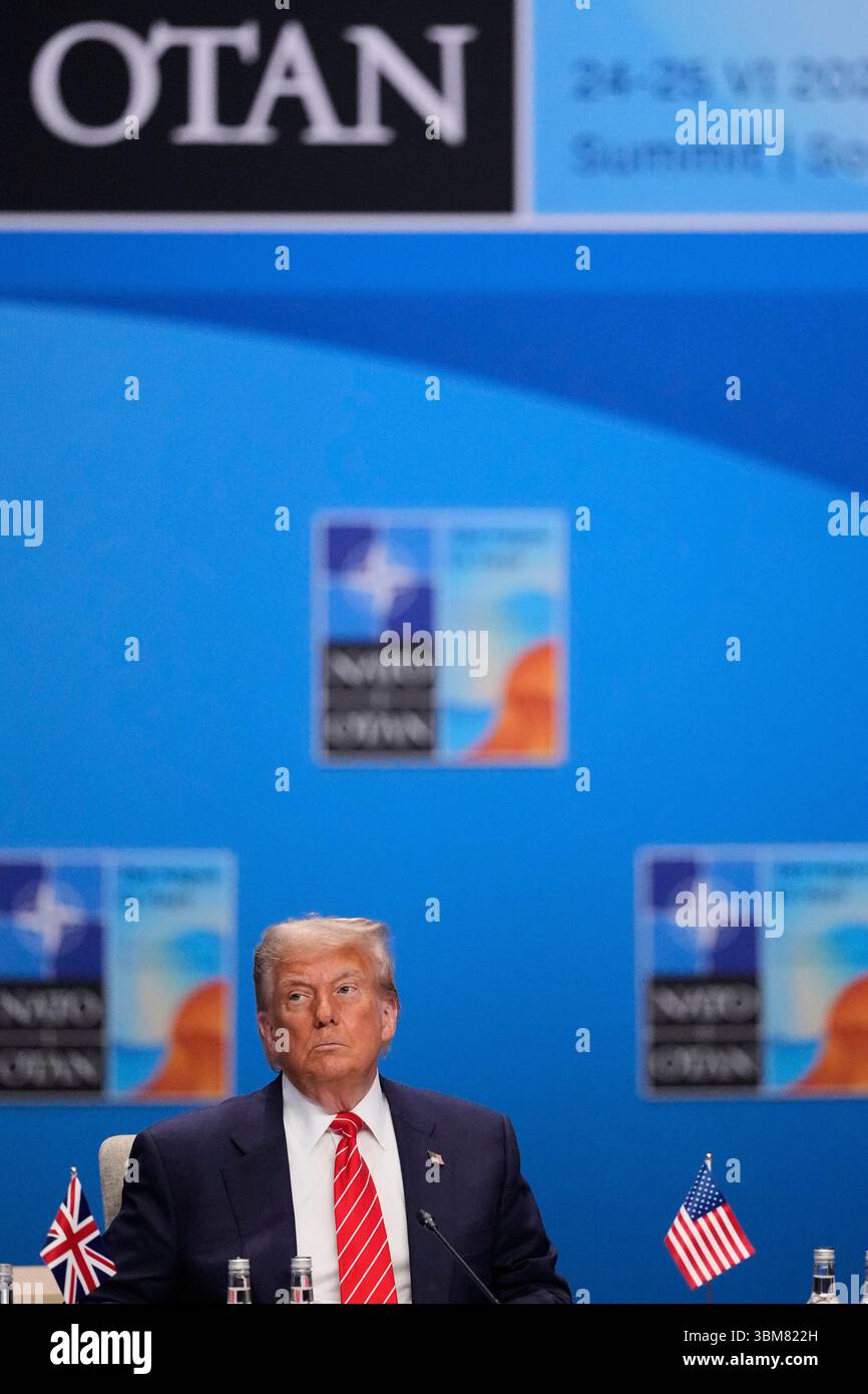 President Donald Trump attends a plenary session at the NATO summit in ...