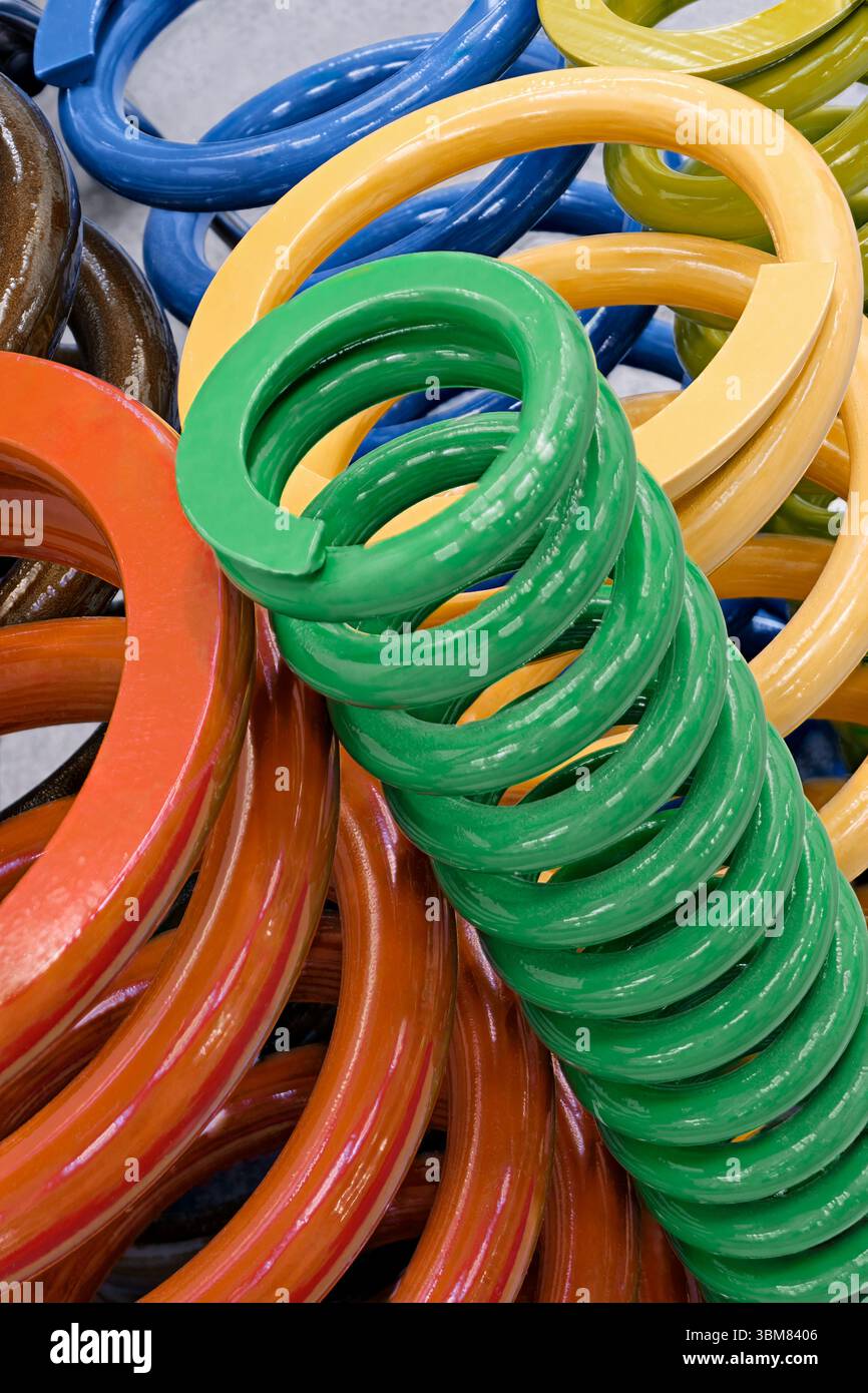 Group of coil springs of different sizes and colors, car suspension ...