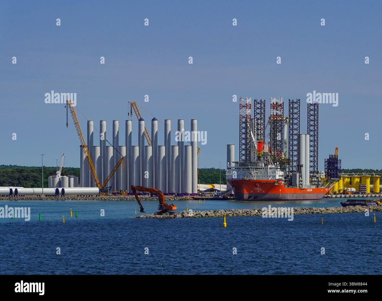 13 June 2025, Denmark, Rönne: Towers for new offshore wind turbines ...