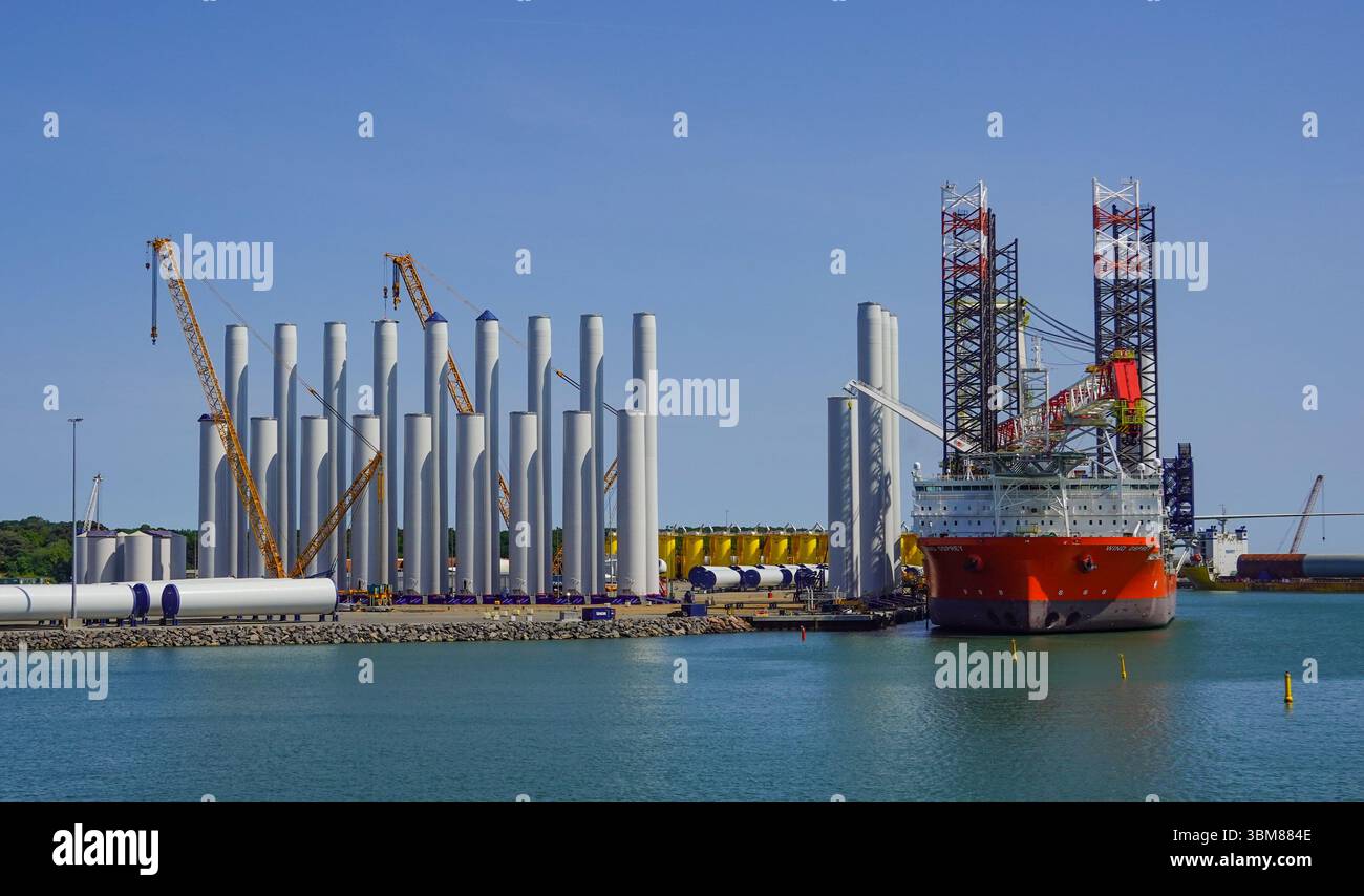 13 June 2025, Denmark, Rönne: Towers for new offshore wind turbines ...