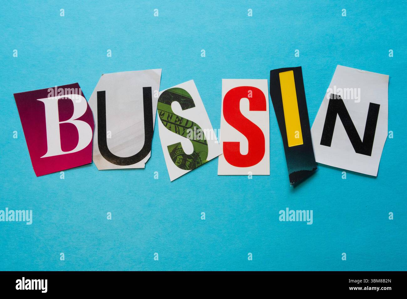 "Bussin" using cut-out paper letters in the ransom note effect ...