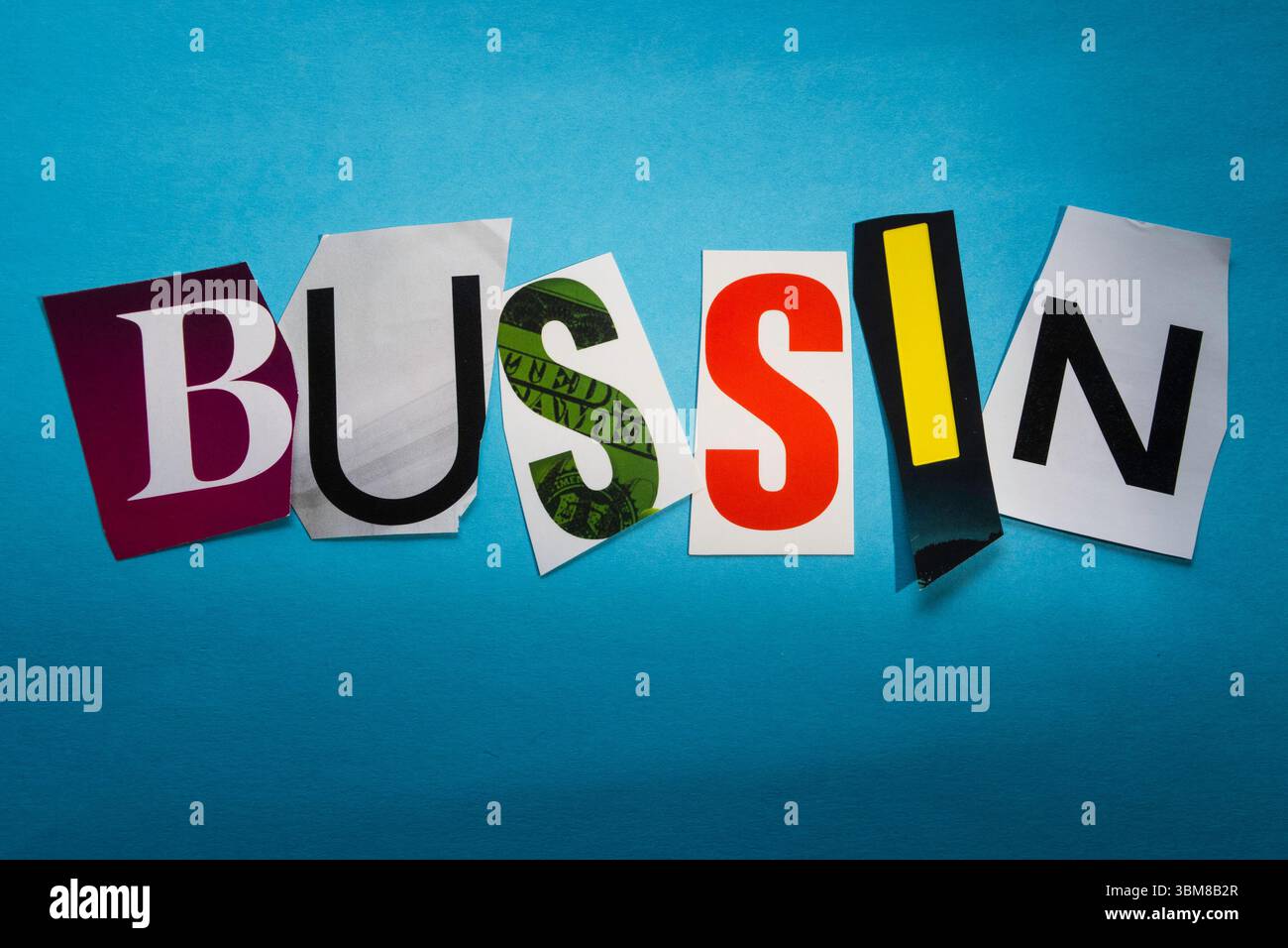 "Bussin" using cut-out paper letters in the ransom note effect ...