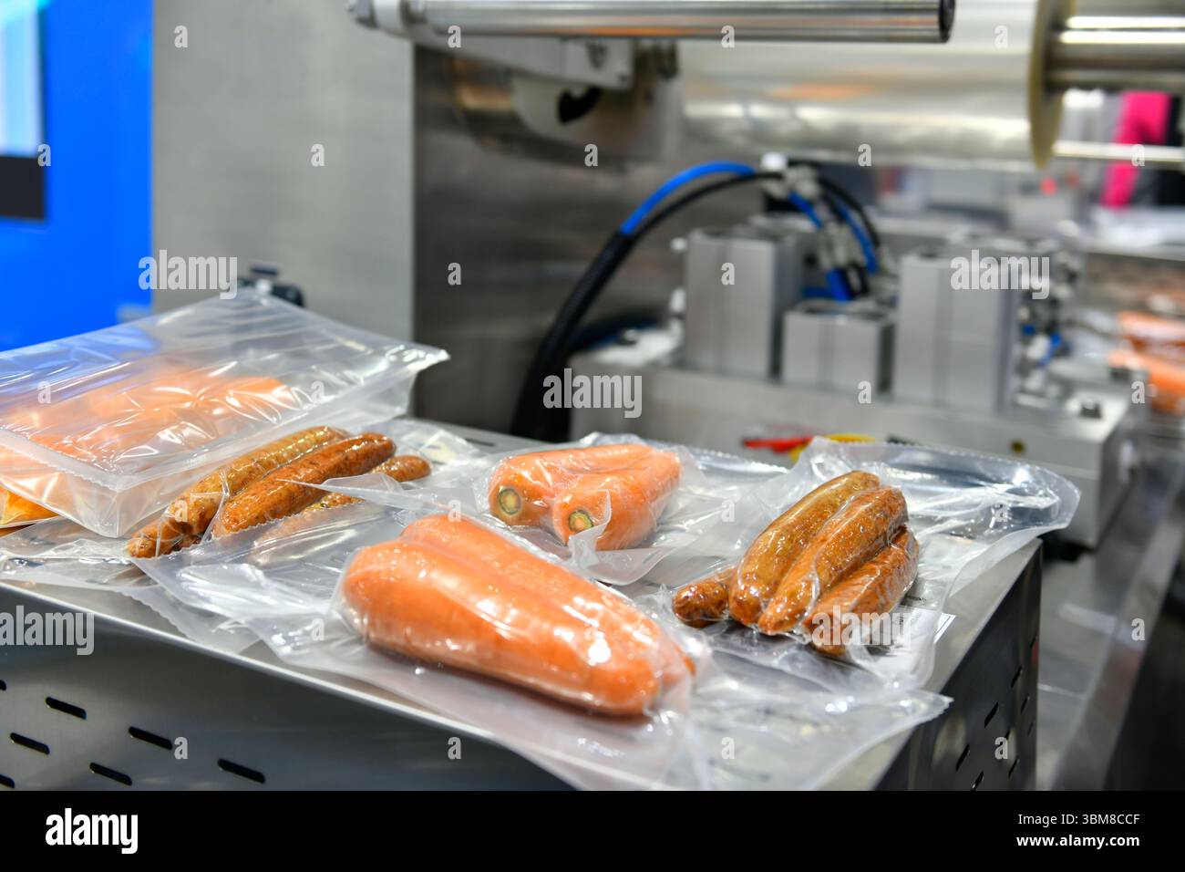 High-performance machines are wrapping food products food in production ...