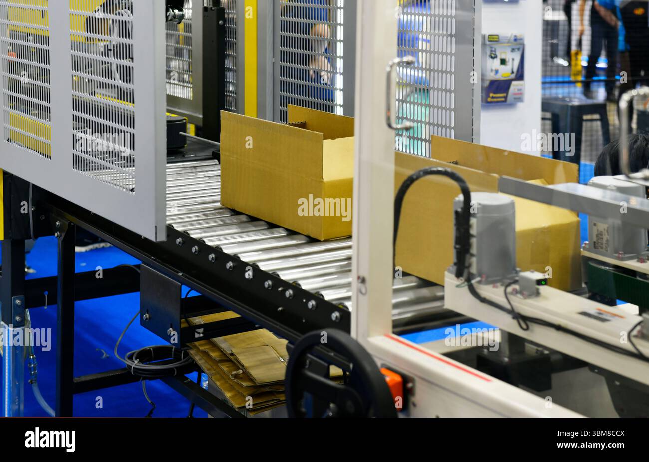 Cardboard boxes on conveyor belt. parcels transportation system concept ...