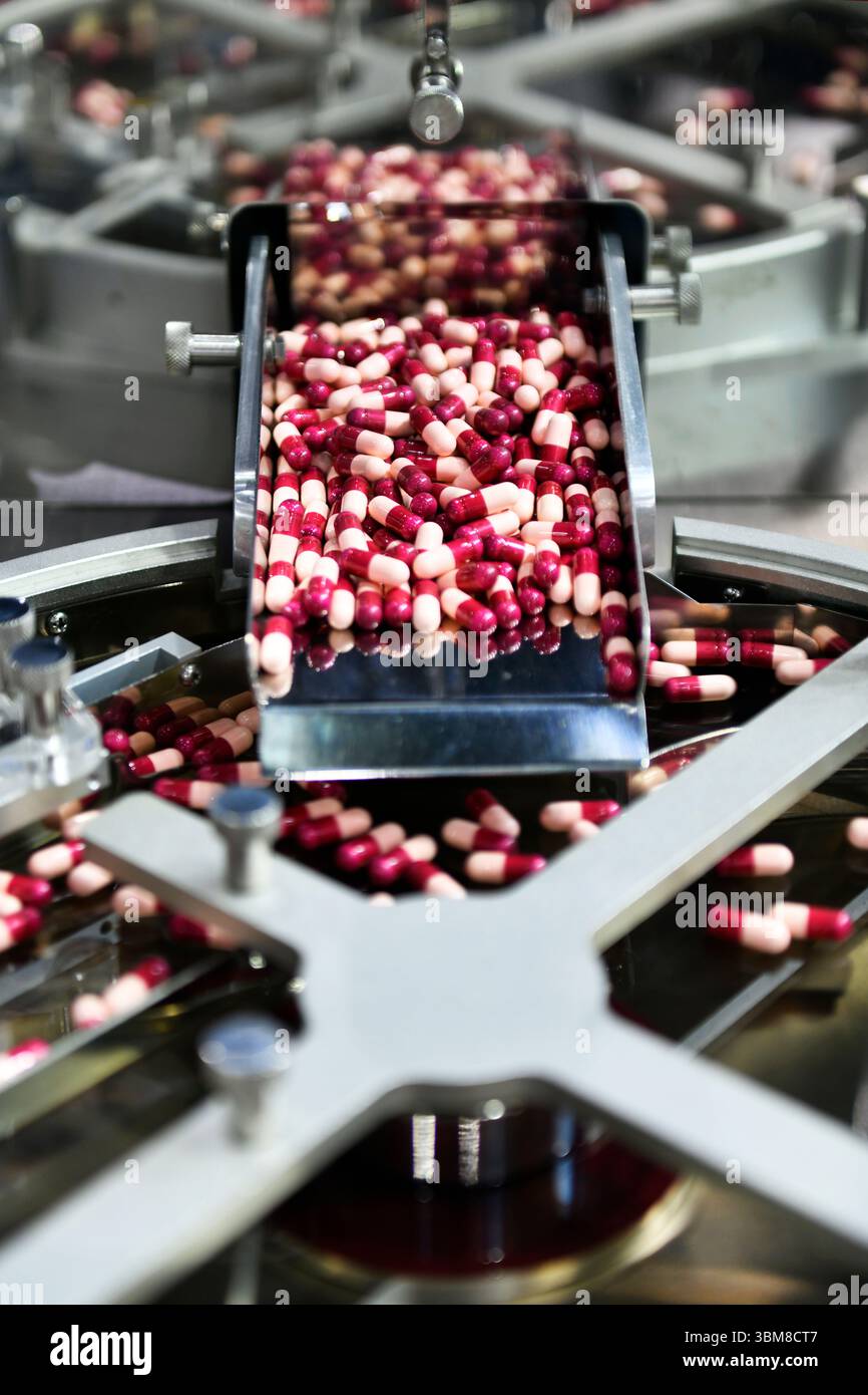 Medicine capsule pill in production line at medical factory, Industrial ...