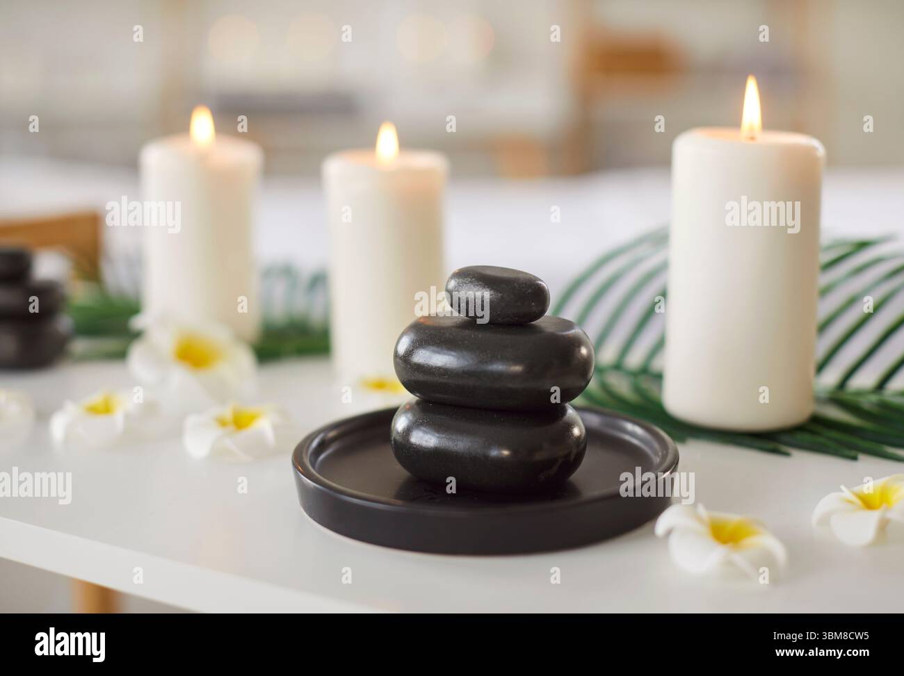 Cosmetology spa salon room desk with massage hot stones, aromatherapy ...