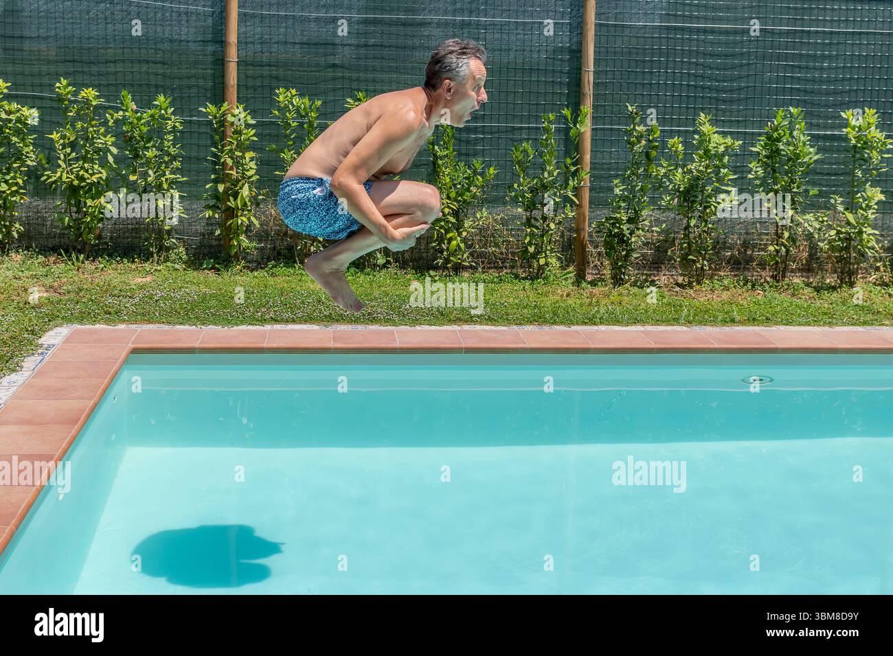 Man dives in pool hi-res stock photography and images - Alamy