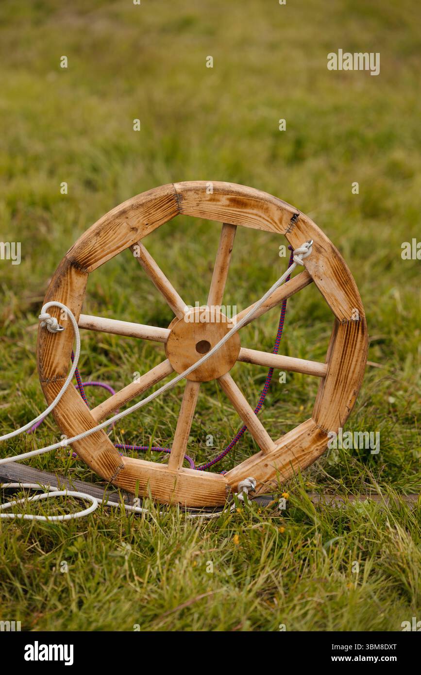 Ancient wooden wheel toy on string with spokes traditional vintage game ...