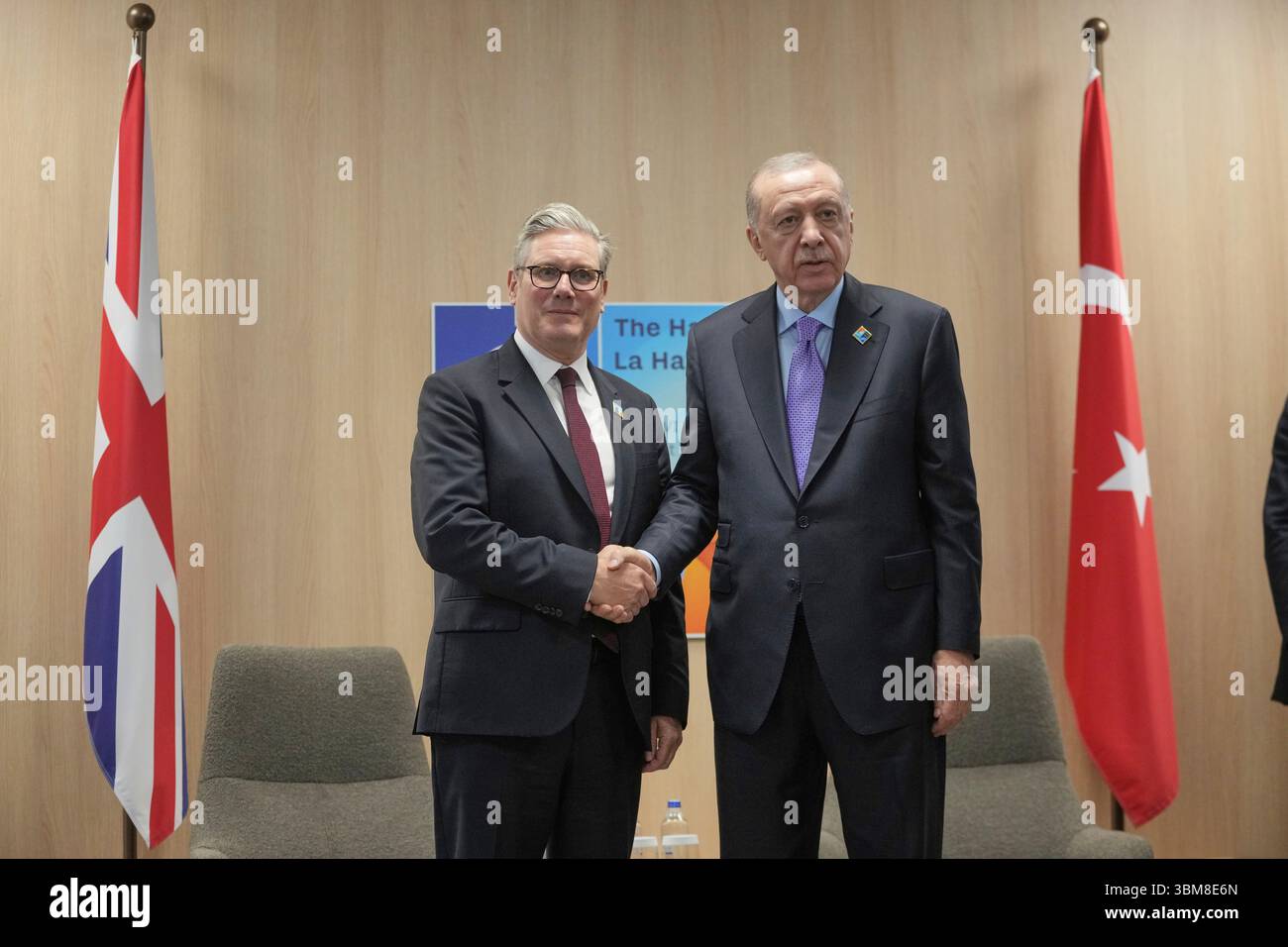 Turkey's President Recep Tayyip Erdogan, right, shakes hands with ...