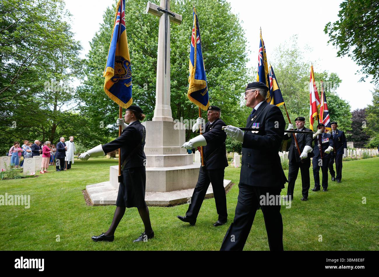 Standard bearers march past the Bramshott War Memorial during the ...