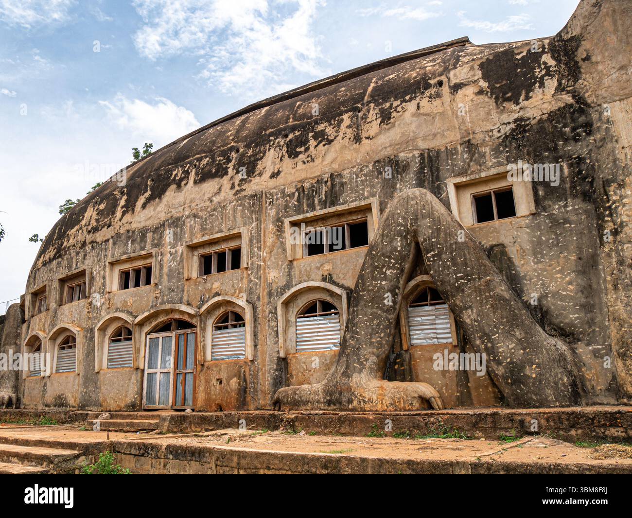 Chameleon-shaped Vodun temple near Abomey, Benin, on a cloudy afternoon ...